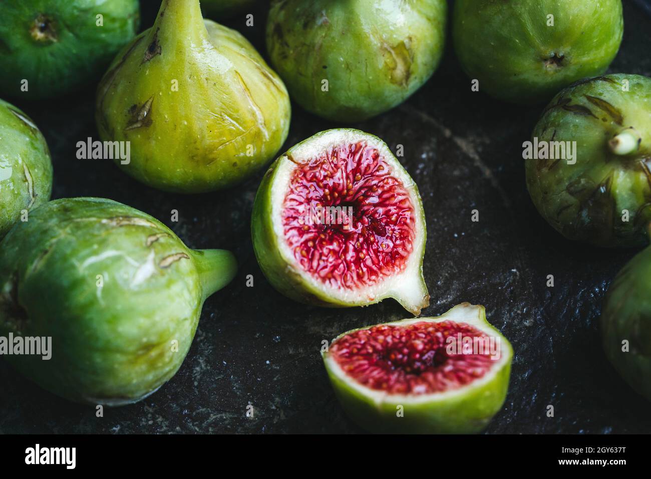Fresh figs on a dark background Stock Photo - Alamy