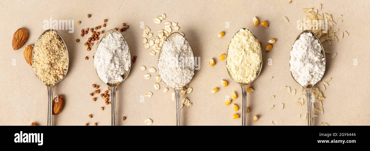 Metal spoons of various gluten free flour (almond flour, oatmeal flour ...