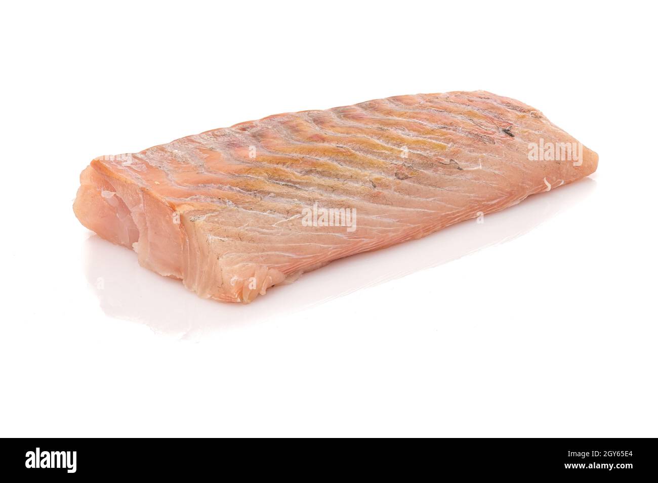 Raw pollack fish loin close-up white isolated Stock Photo - Alamy
