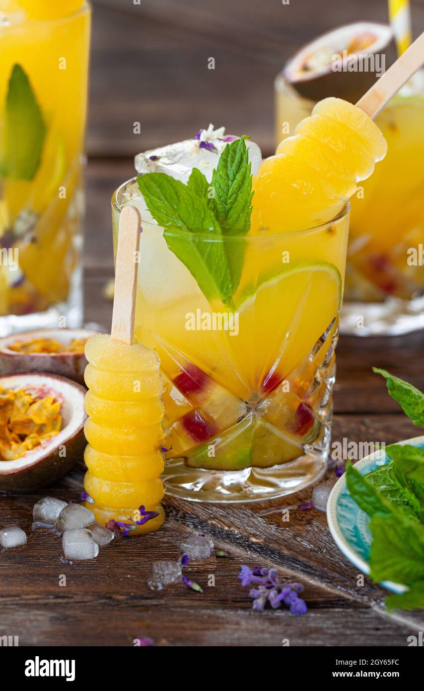 Ice cold cocktail with fresh passion fruit and mint leaves Stock Photo ...