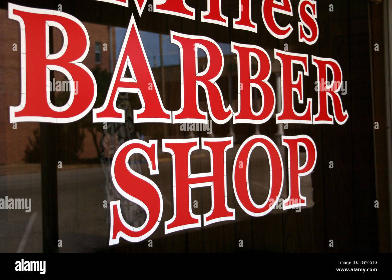 Barber shop Sign in Window of Barber Shop Stock Photo - Alamy