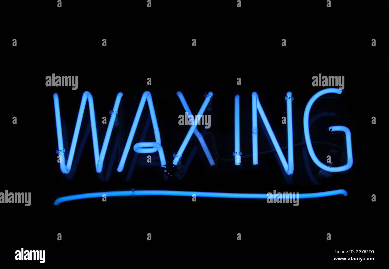 Vintage Neon Waxing Sign in Salon Window Stock Photo - Alamy