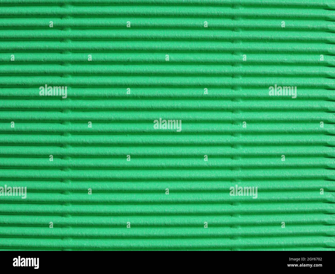 green cardboard texture useful as a background Stock Photo - Alamy