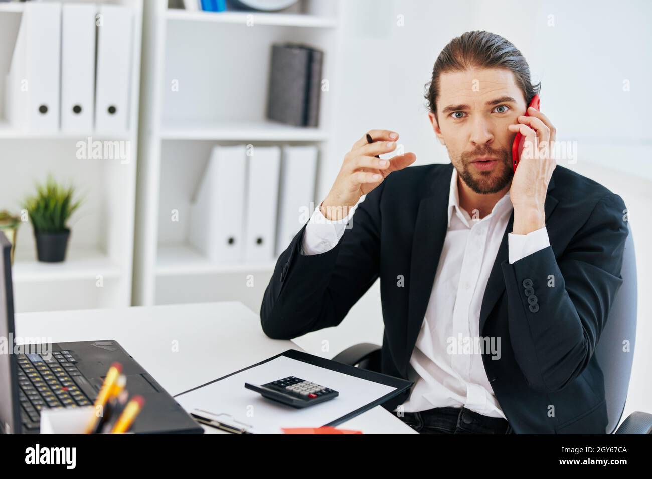 office worker at the desk documents communication by phone Lifestyle ...