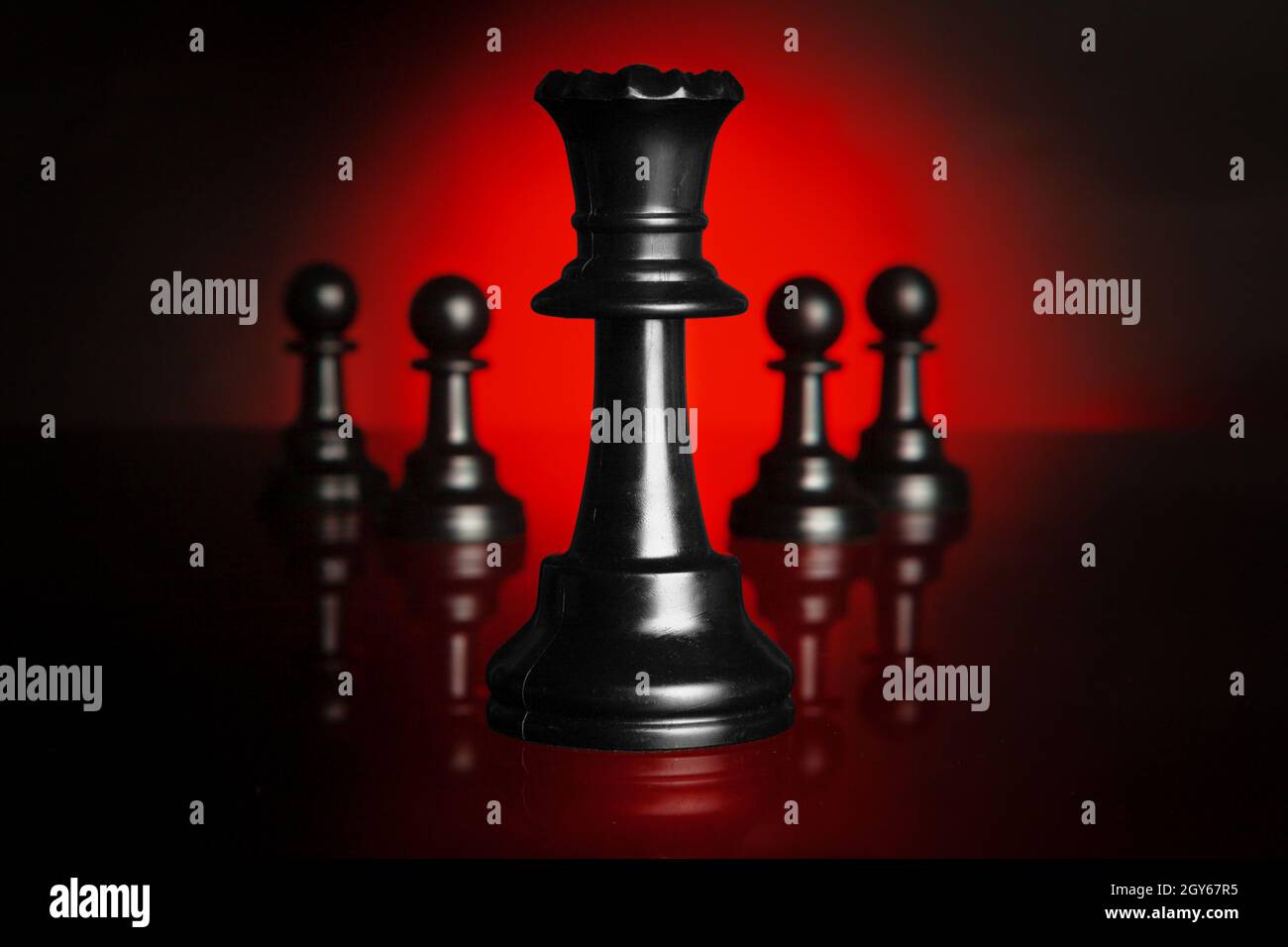 Chess pieces on dark background with red backlight close up Stock Photo ...