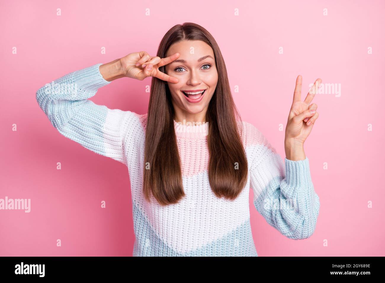 Photo of cheerful cool pretty young woman make v-signs good mood ...