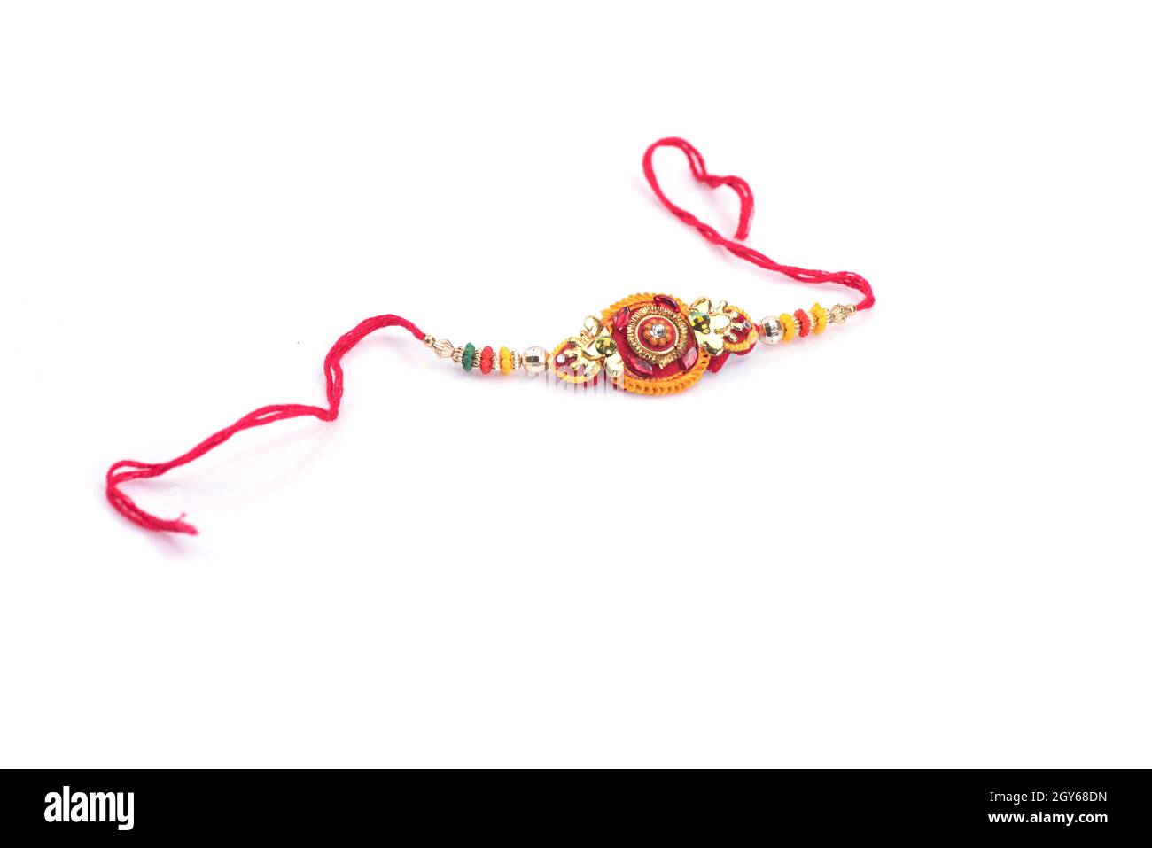Indian festival: Raksha Bandhan background with an elegant Rakhi on a ...