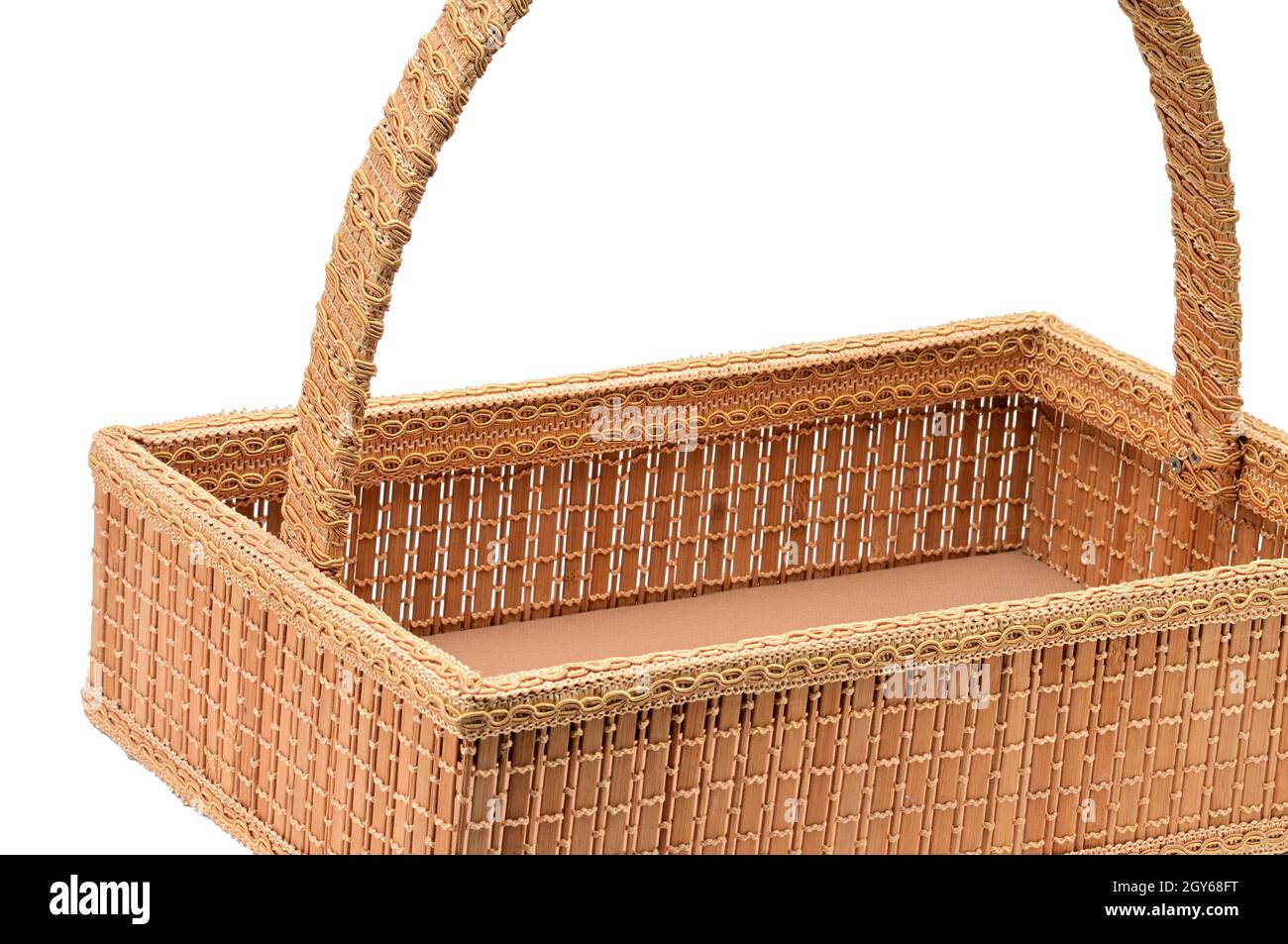 Straw basket on an isolated white background Stock Photo - Alamy