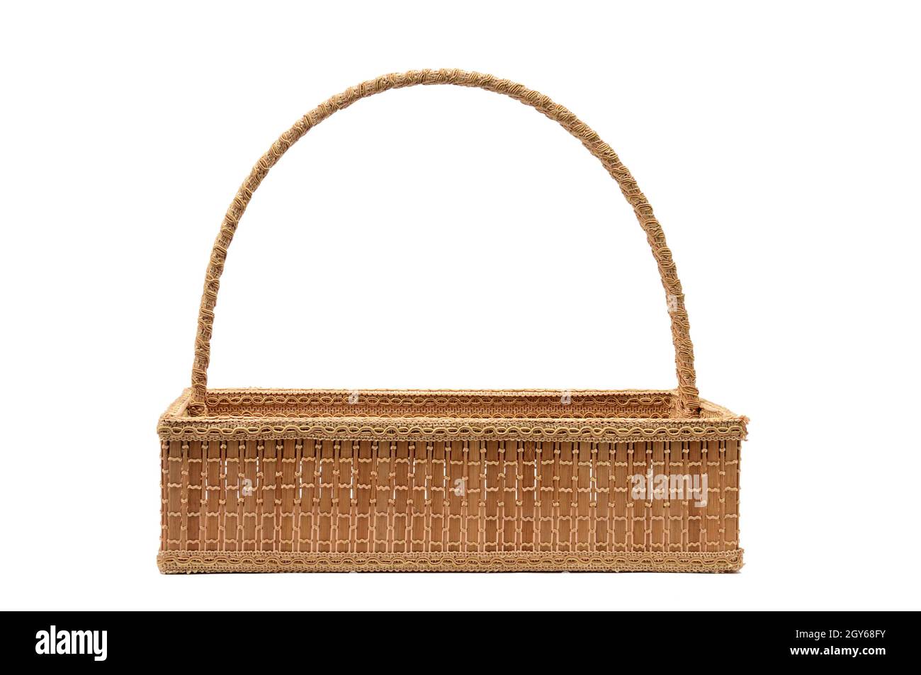 Straw basket on an isolated white background Stock Photo - Alamy