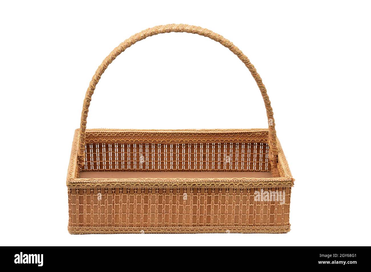 Straw basket on an isolated white background Stock Photo - Alamy