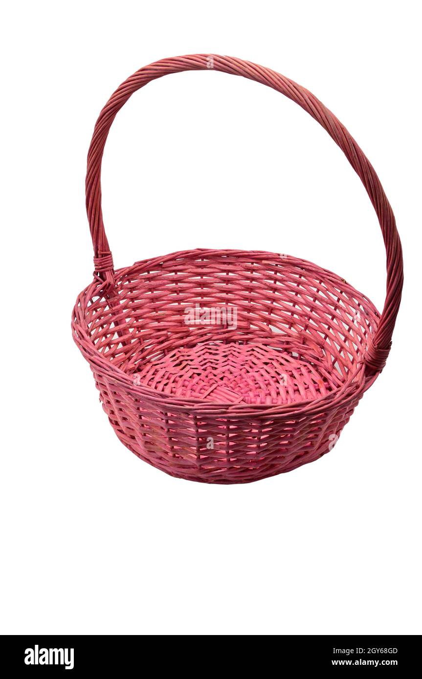 Straw basket on an isolated white background Stock Photo - Alamy