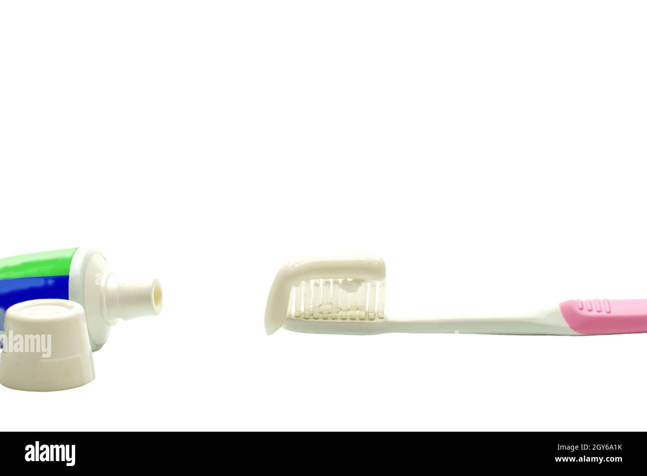 The toothpaste on the toothbrush on a white background Stock Photo - Alamy