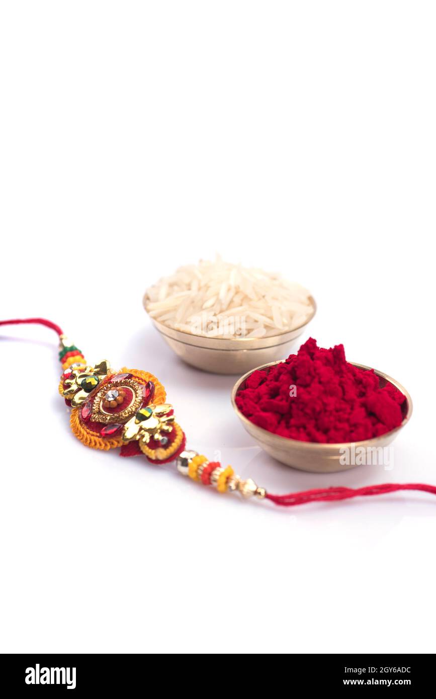 Indian festival: Raksha Bandhan background with an elegant Rakhi on a ...