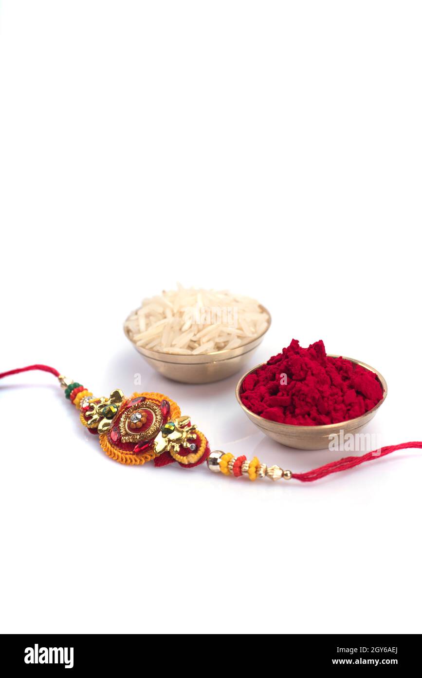 Indian festival: Raksha Bandhan background with an elegant Rakhi on a ...