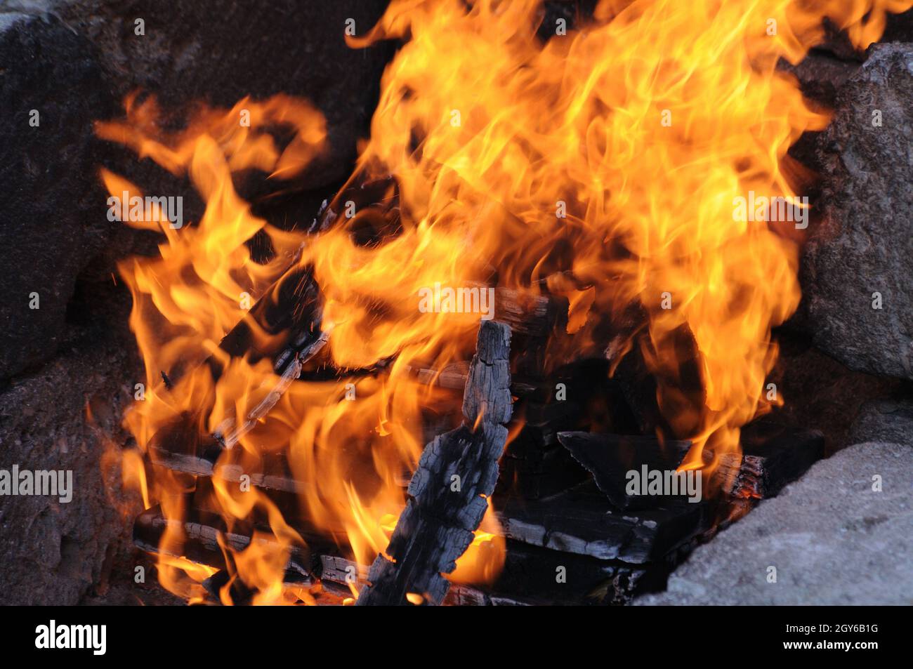 Campfire fire kindled in a camping trip Stock Photo - Alamy