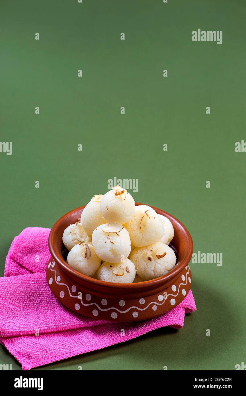 Indian Sweet - Rasgulla, Famous Bengali sweet in clay bowl with napkin ...