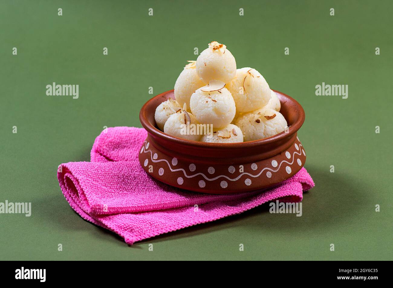Indian Sweet - Rasgulla, Famous Bengali sweet in clay bowl with napkin ...