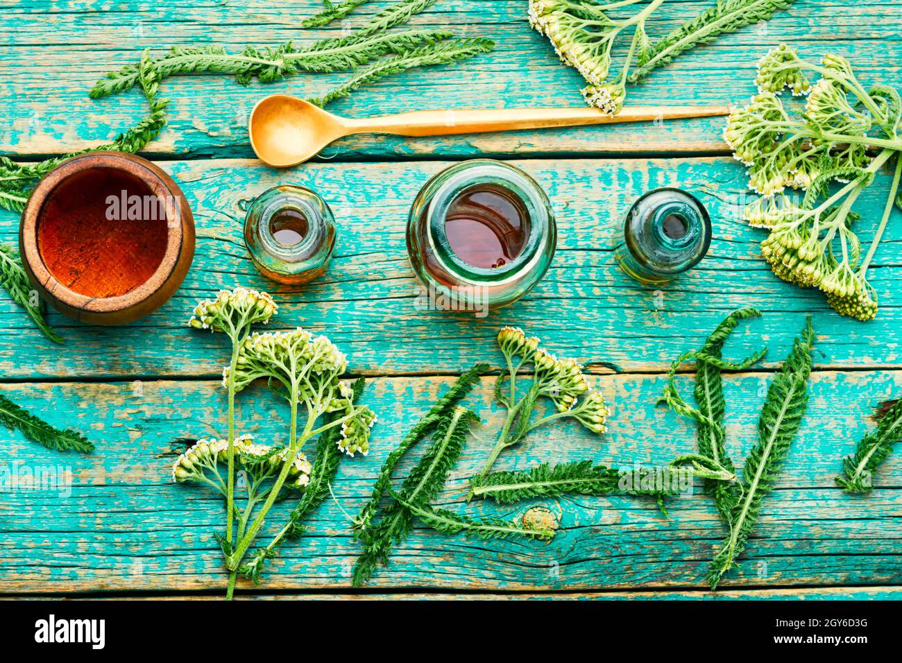 Jar of yarrow tincture.Medicine made from healing herbs on wooden ...