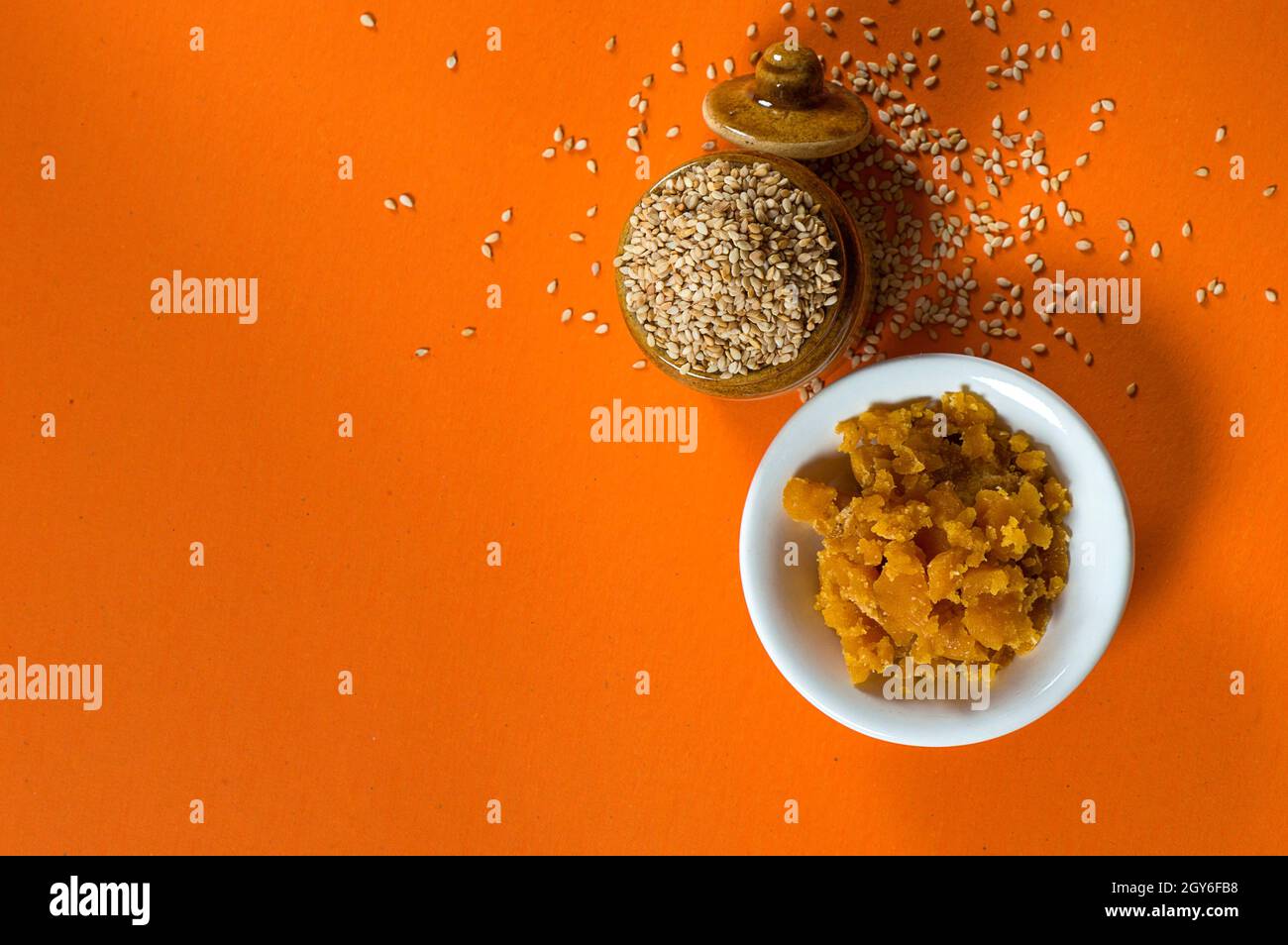 Sesame Seeds in clay pot with Jaggery in bowl Stock Photo - Alamy