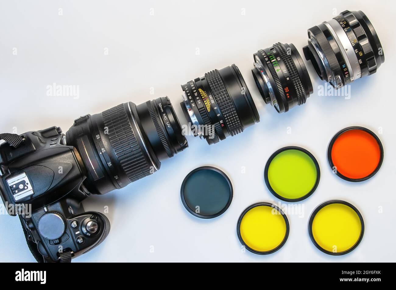 camera, color otic filters and photo lenses on white background ...