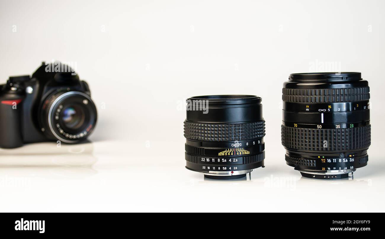 Camera and photo lens on white background with reflection Stock Photo ...