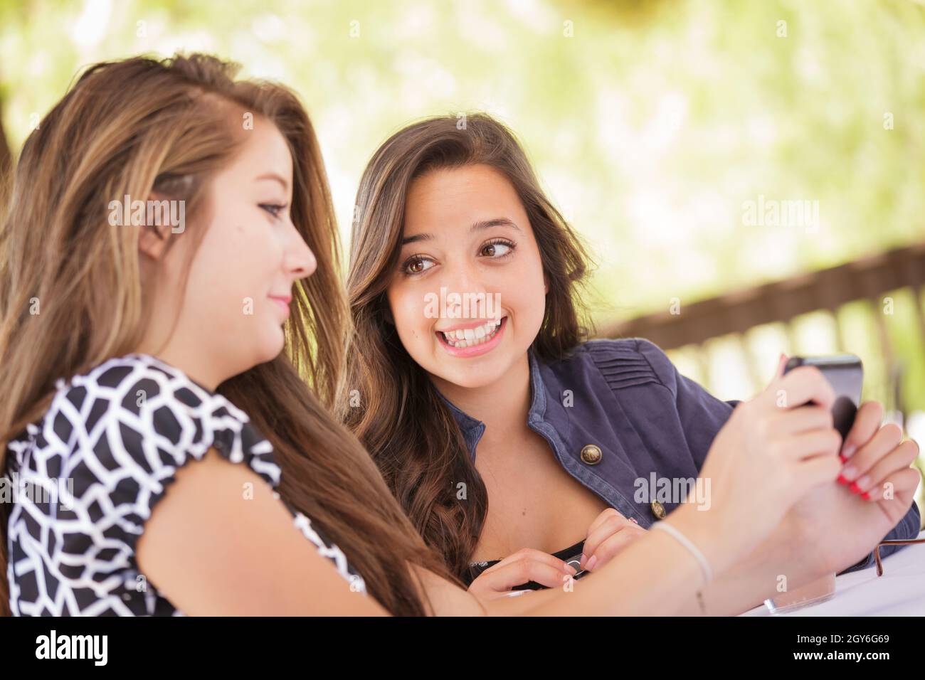 Expressive Young Adult Girlfriends Using Their Smart Cell Phone ...