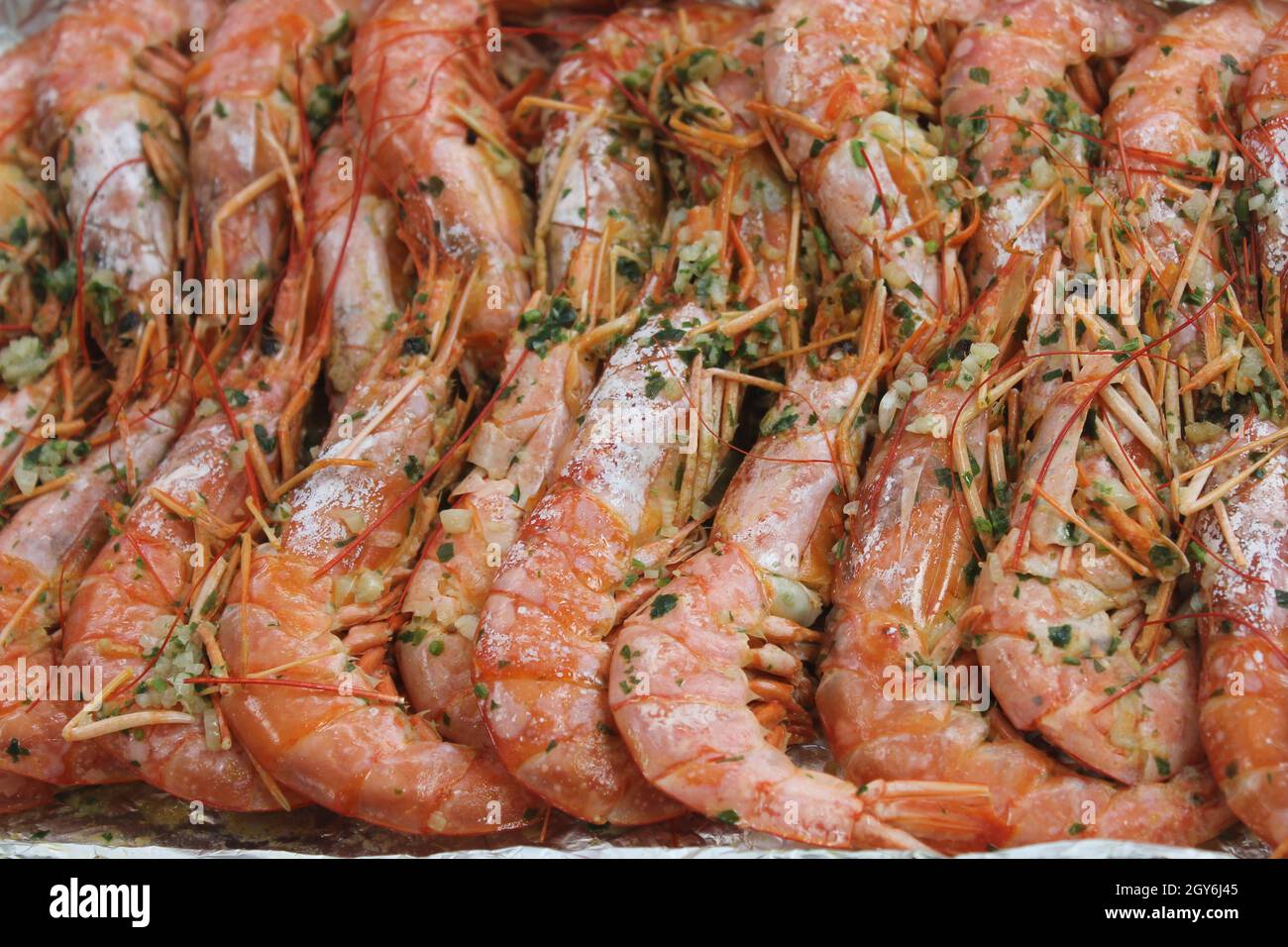 delicious grilled prawns hot grilled seafood prawns Stock Photo - Alamy
