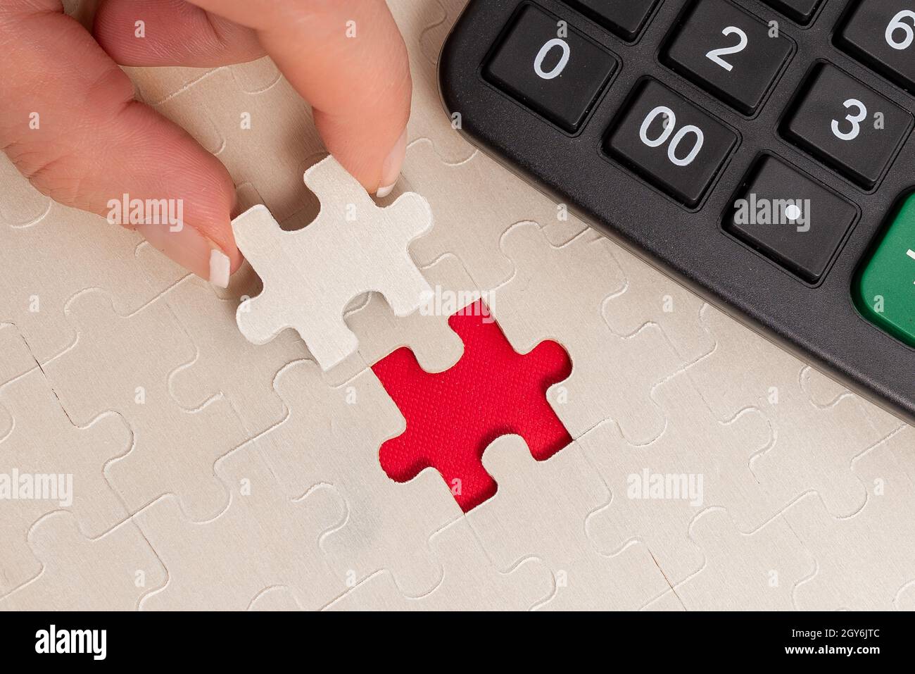 Building An Unfinished White Jigsaw Pattern Puzzle With Missing Last ...