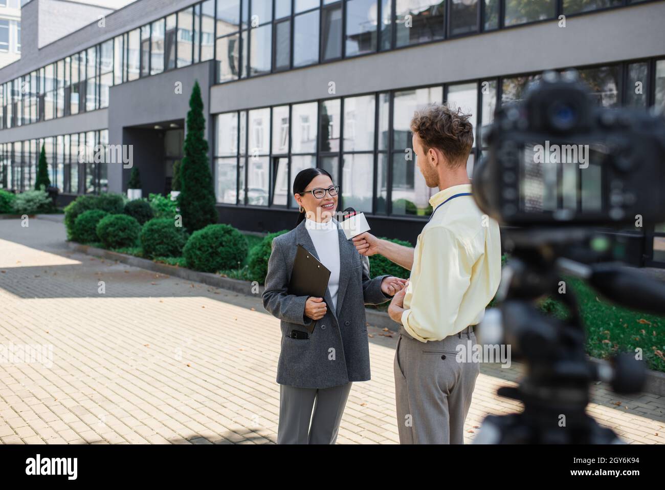 Standing communication microphone smiling hi-res stock photography and ...