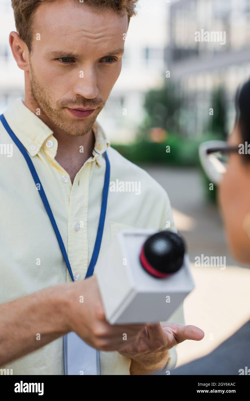 Man interview microphone woman hi-res stock photography and images - Alamy