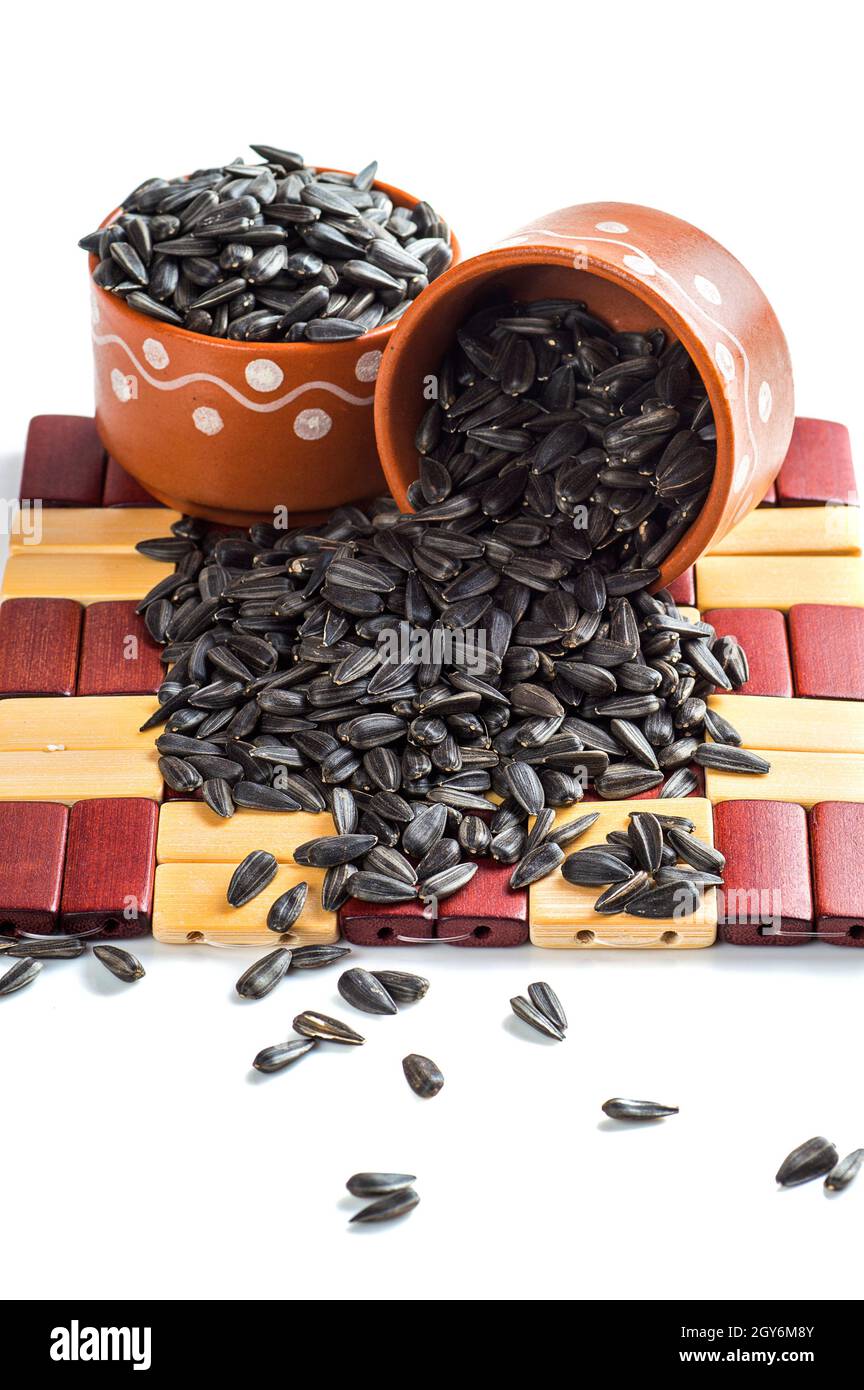 Sunflower Seeds (Helianthus annuus) on white background Stock Photo - Alamy