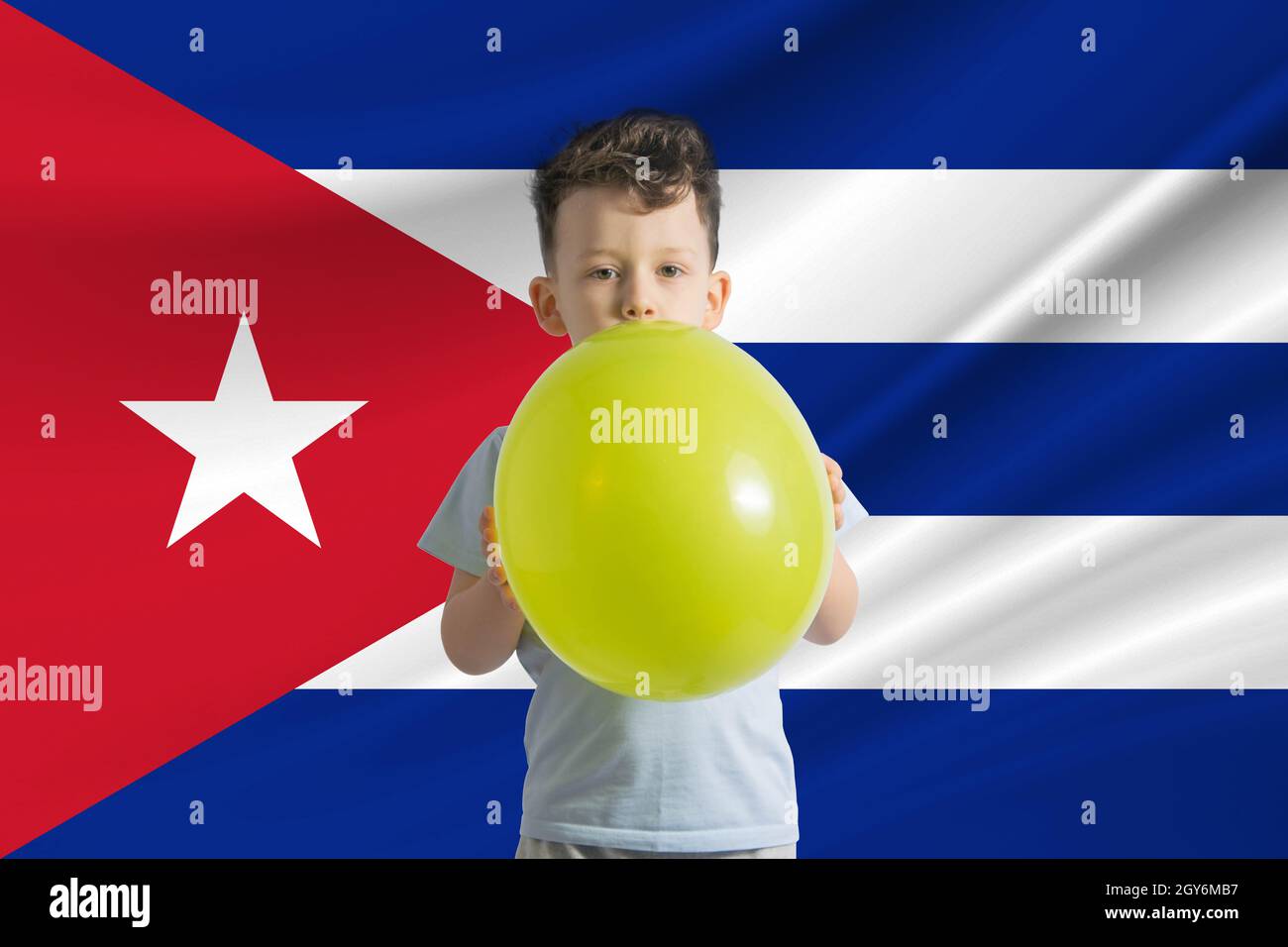 Children's day in Cuba White boy with a balloon on the background of ...