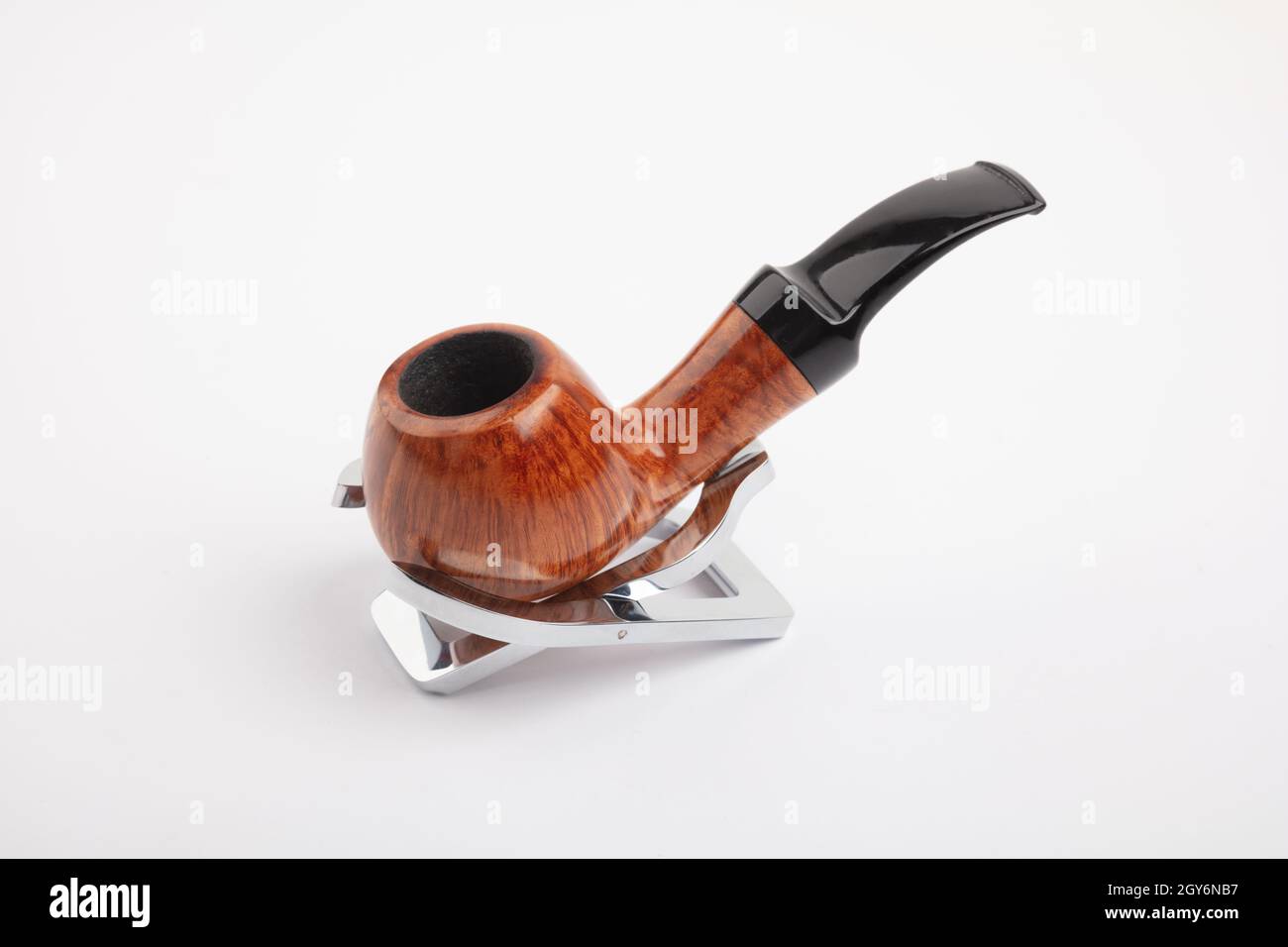 Beautiful brown Pipe on a stand on white background Stock Photo - Alamy