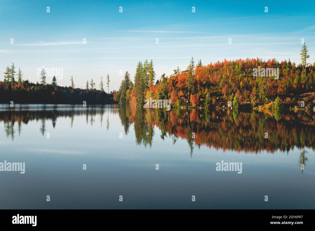 Mirroring by autumn lake. Colorful scenery. Reflexion, colorful trees ...