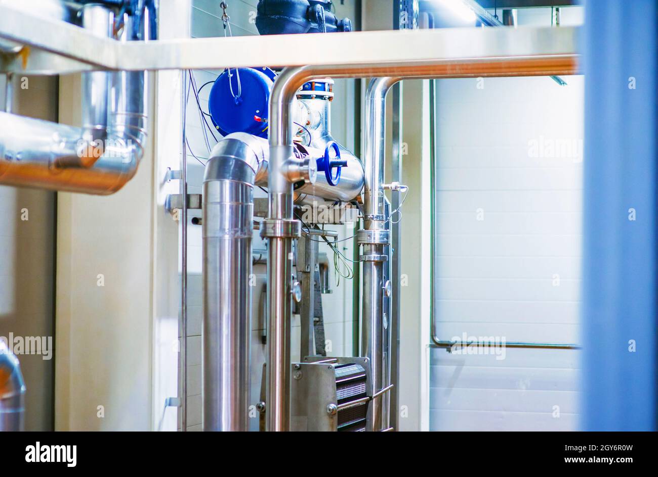 Stainless steel pipes in the factory. Construction on food production ...