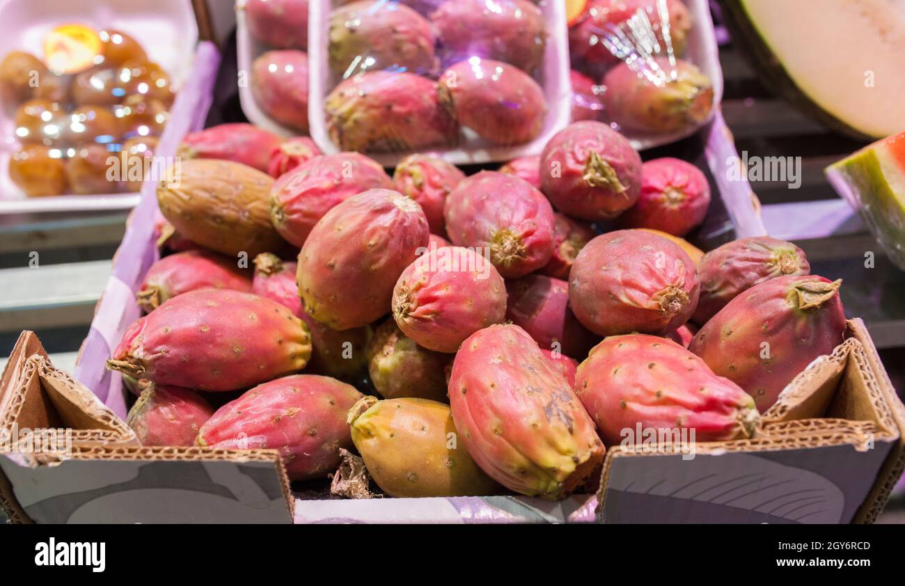 Clean prickly pear or barbary figs. Exhibited on cardboard box and ...