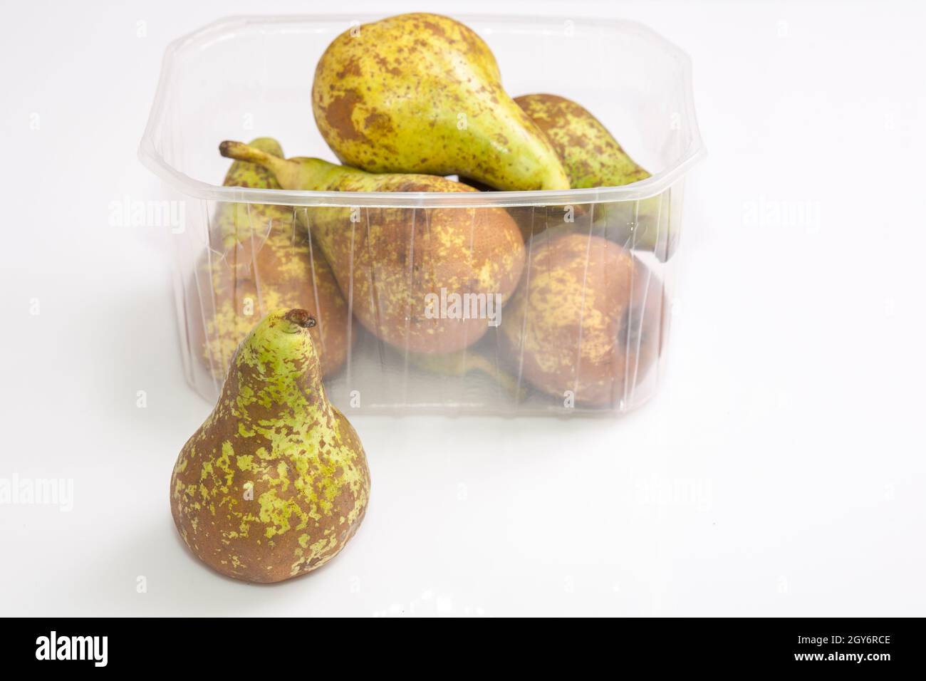 Conference pears on their plastic package. Uncovered Stock Photo - Alamy