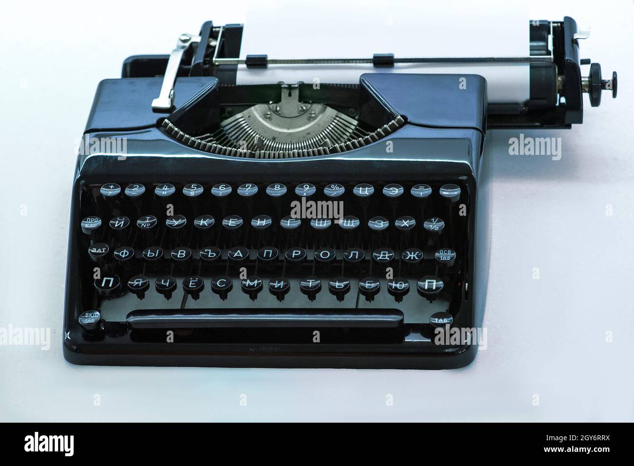 Old vintage typewriter with blank sheet of paper inserted Stock Photo ...