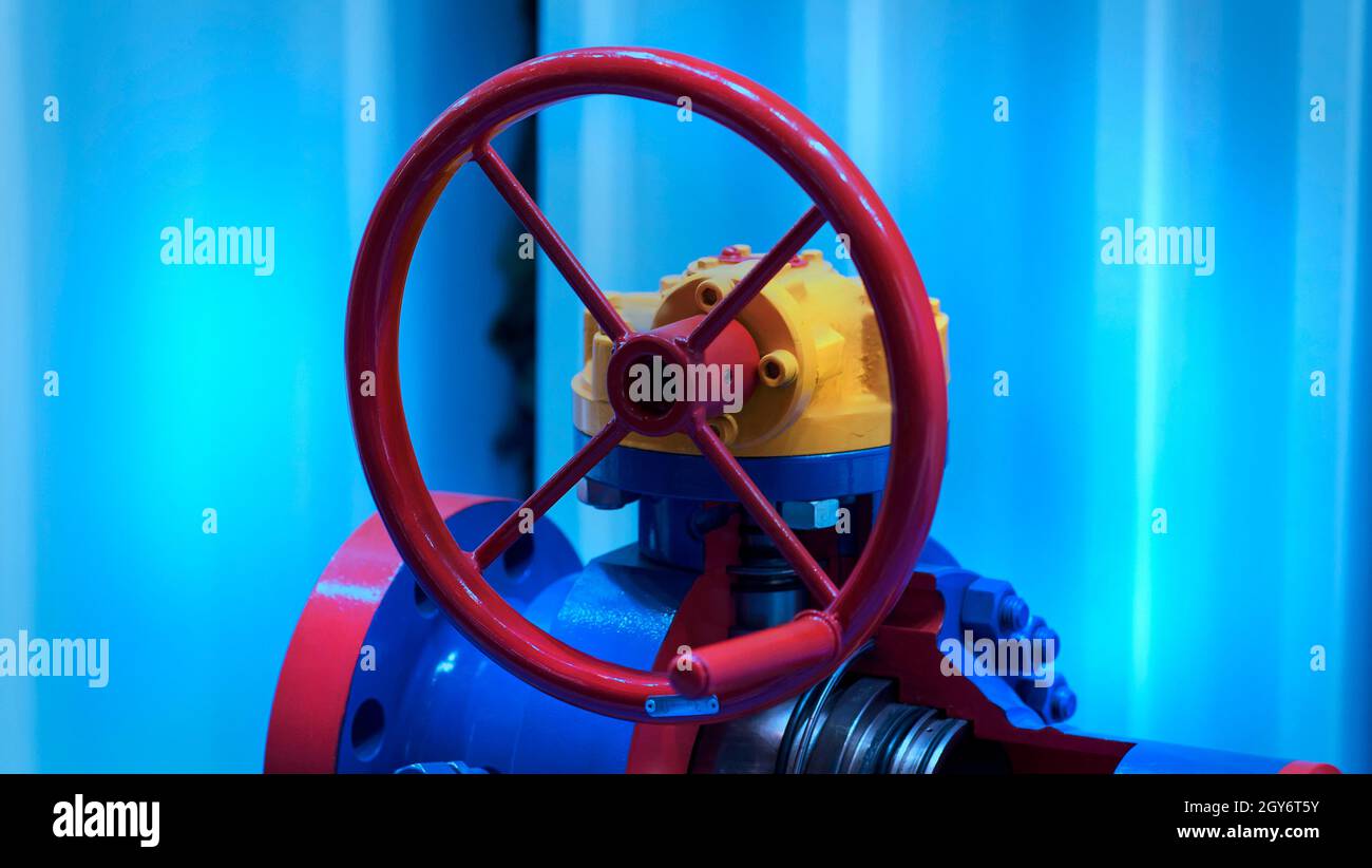 Close up of manual operate blue metal ball valve and pipes industrial ...