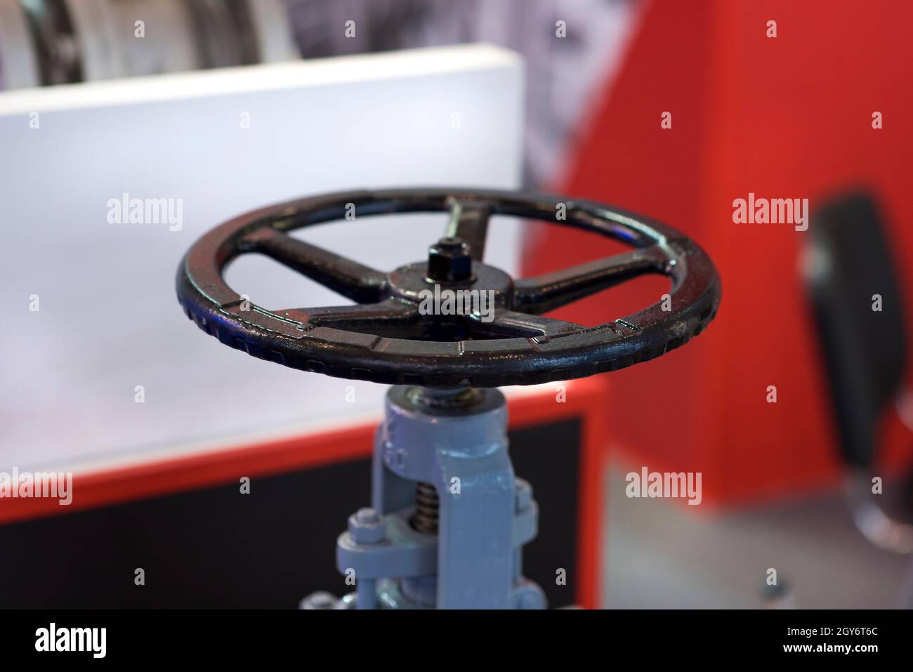 Close up of manual operate blue metal ball valve and pipes industrial ...