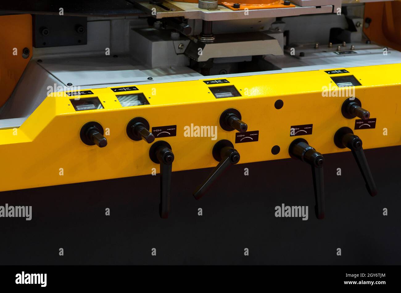 Operator machining automotive part by turning machine, Industry machine ...