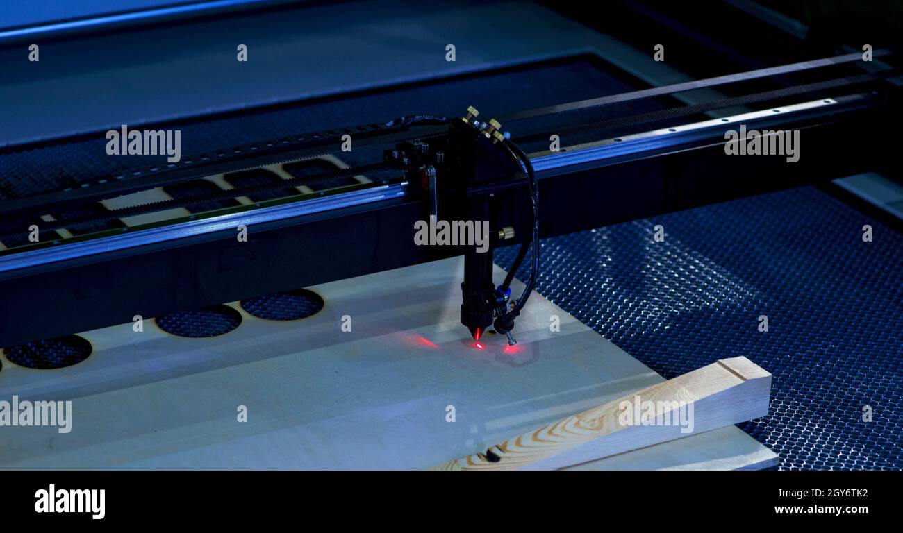 CNC versatile laser wood carving machine background Stock Photo - Alamy