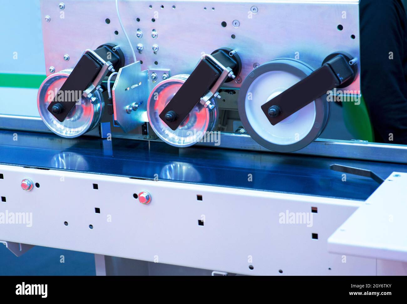 Conveyor belt of packaging folding machine at print factory Stock Photo ...