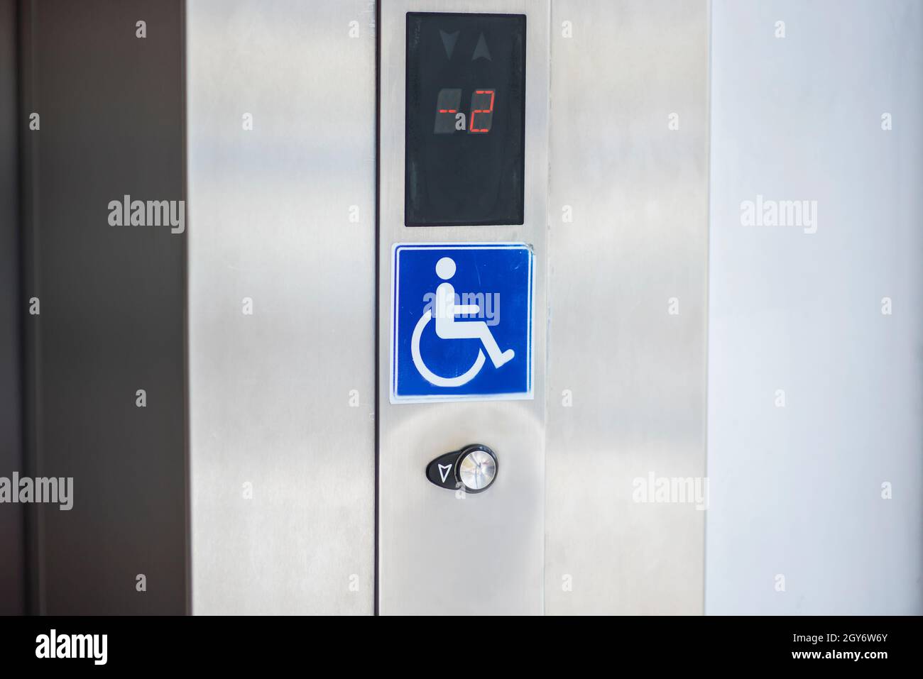 Disabled sign in the lift for disabled persons Stock Photo - Alamy