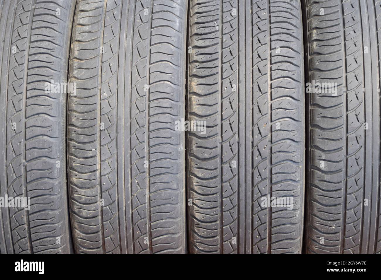 The background of the tread pattern of the car wheel. Rubber tires ...
