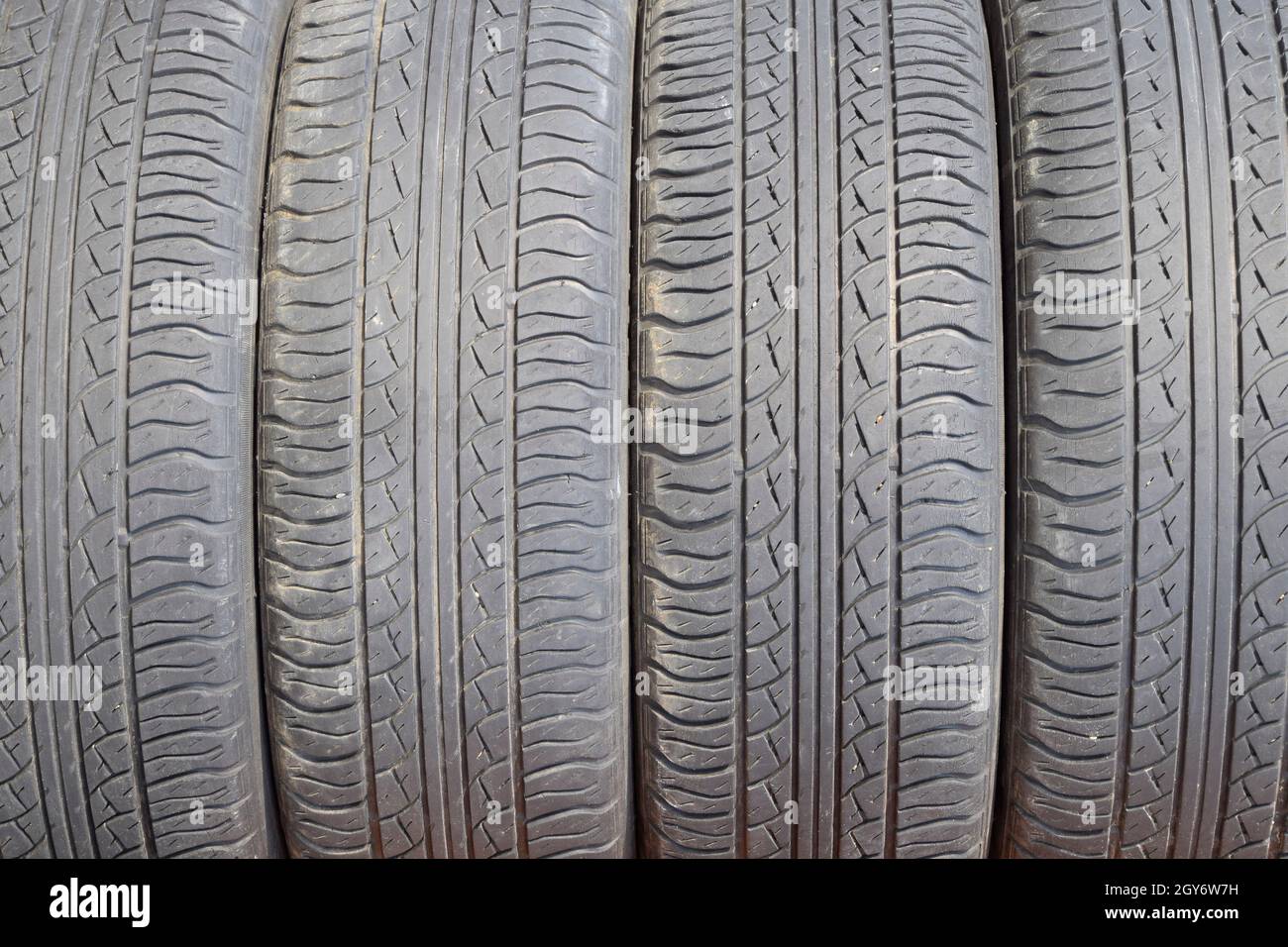 The background of the tread pattern of the car wheel. Rubber tires ...