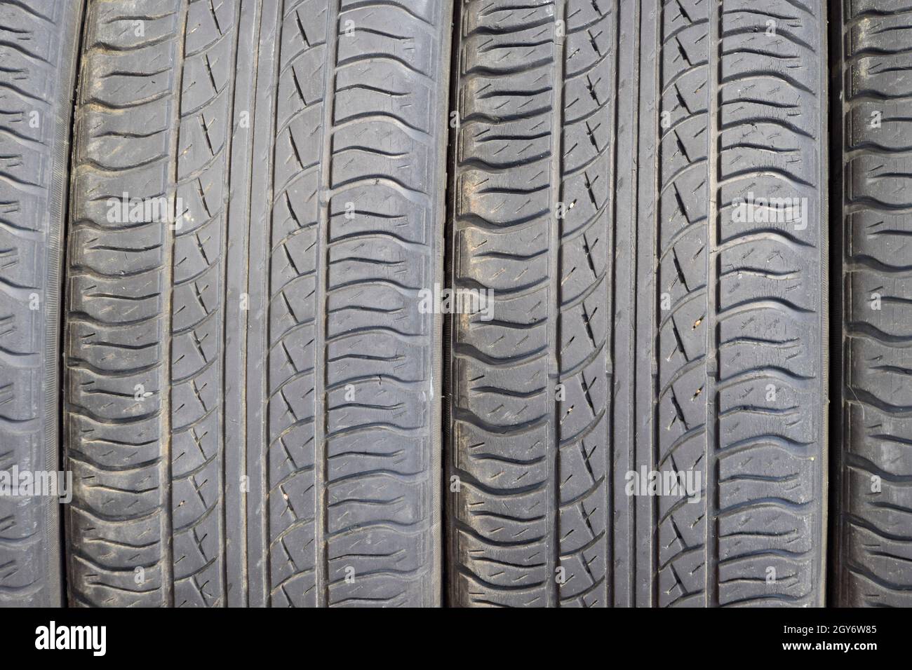 The background of the tread pattern of the car wheel. Rubber tires ...