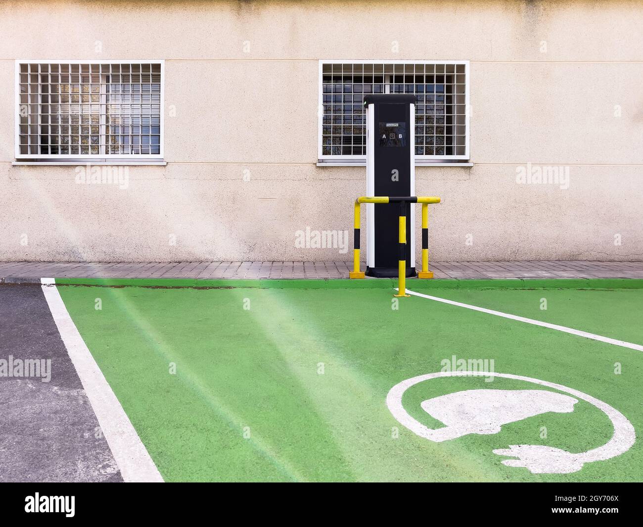 Electric car charging point in a city. road signage at an electric car ...