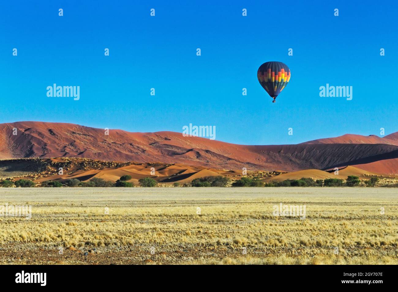 Hot air balloon floating in the Namib Desert, Sossusvlei, Namibia ...