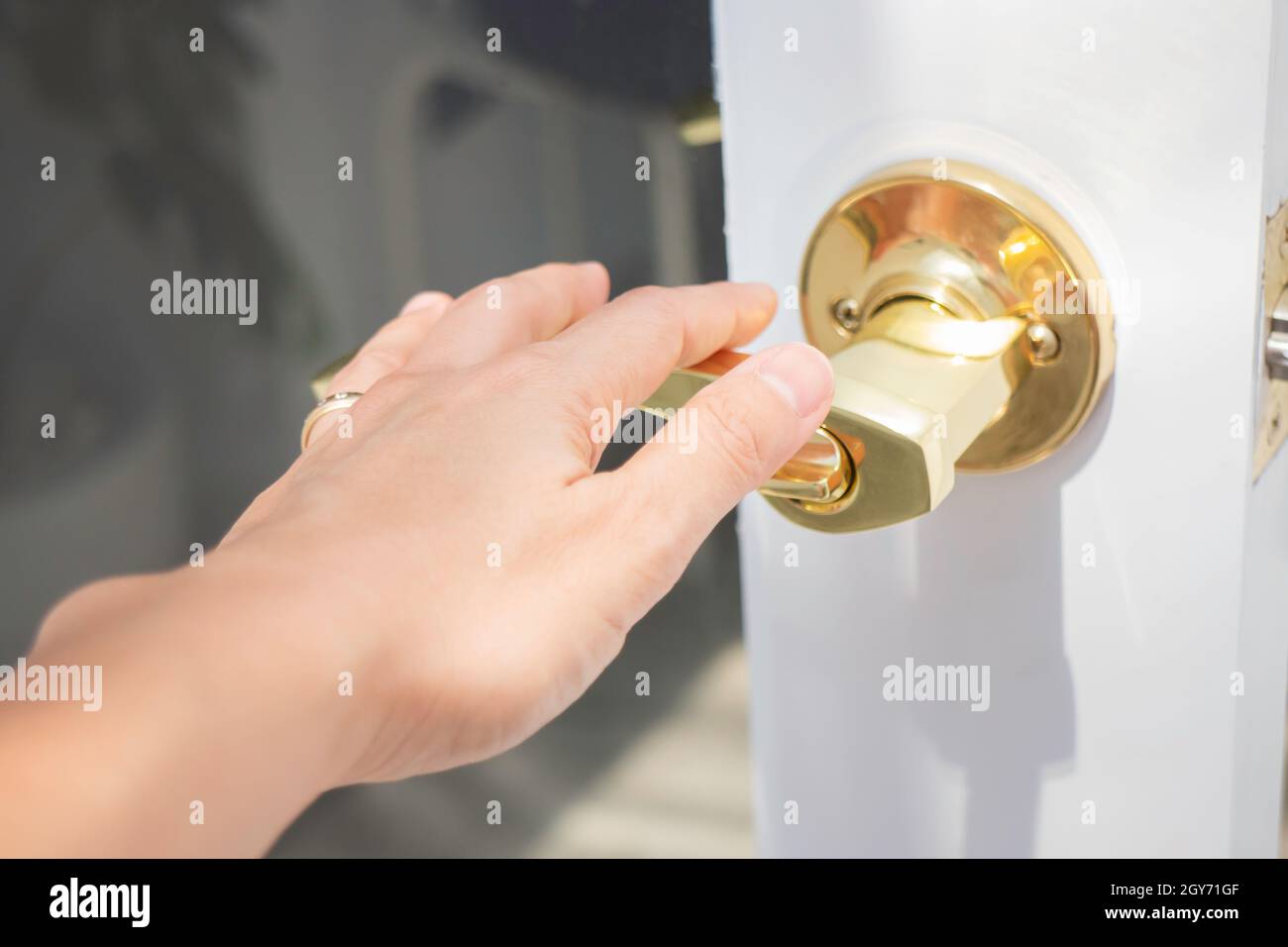 Golden handles on a glass door, stock photo Stock Photo - Alamy